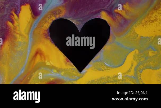Paint sparkle heart. Love ink. Defocused yellow purple multicolor ...