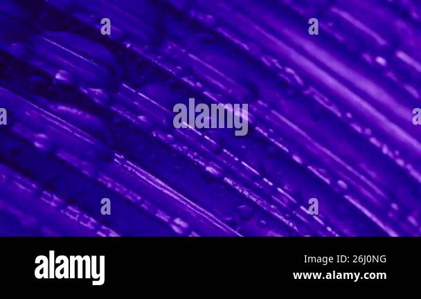 Bokeh moisture. Raindrops flow. Clean water spill over striped grooved ...