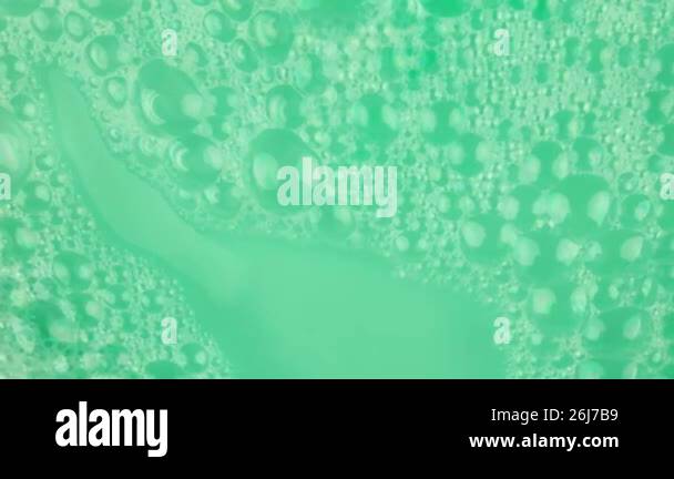 Transparent soap bubbles on green turquoise background. Soapy bubbles ...