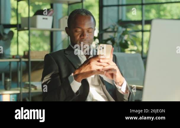 African american man is using smartphone texting communicate online ...