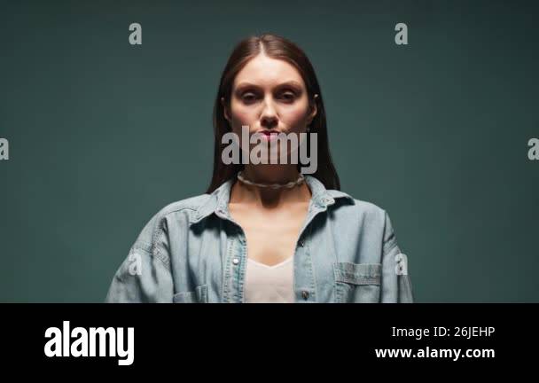 Light from top portrait of beautiful woman turns head look on camera ...