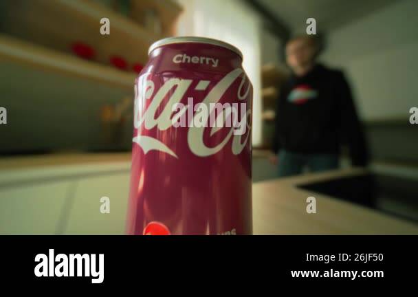 A CocaCola can by a sunlit window creates an inviting vibe, making ...