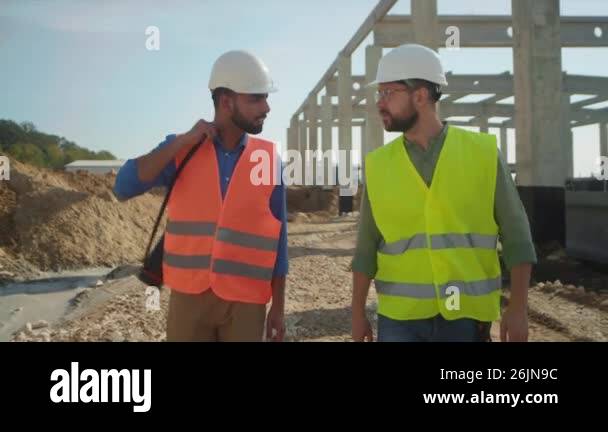 Footage of Turkish and Caucasian engineers in white helmets dressed in ...