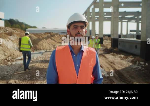 Footage of young Turkish worker dressed yellow vest and white ...