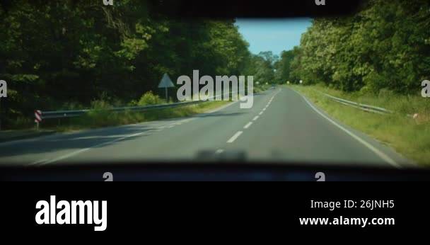 View from a car window on road and landscape sunlight outside on a ...