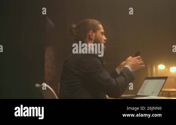 At night office angry businessman sit at desk feel stress and mad with ...