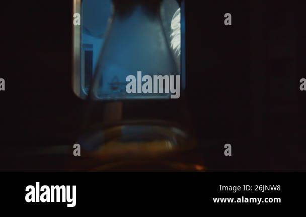 Close up hands of scientists take tubes with liquid from the special ...