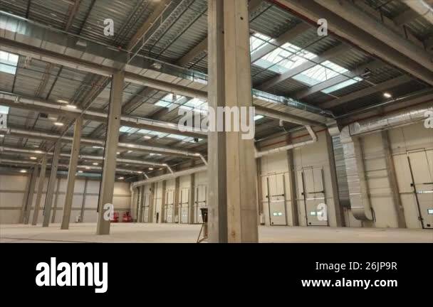 Horizontal shooting of modern big empty area. Industrial room for ...