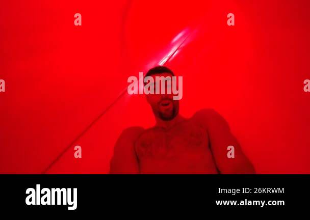 Man sliding down at water slide in aquapark. Guy having amusement and ...