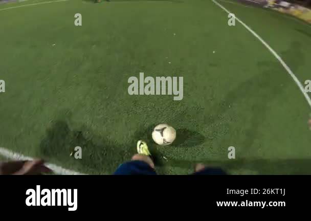 Point of view of soccer player training his skills at football field at ...