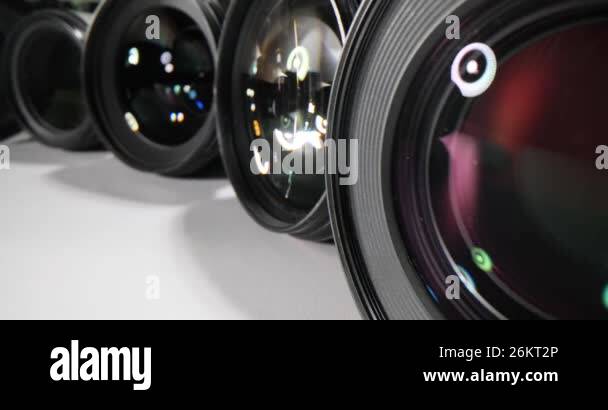 Study of camera lenses lined up in studio setting. Modern cameras in art of photography Stock ...
