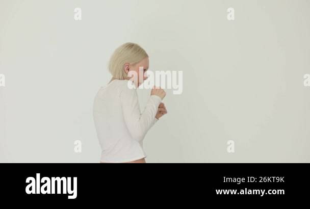 Brave confident woman clenched fist ready to punch on white background ...