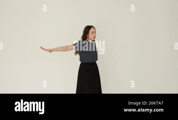 Woman dancing gracefully and making her hands fly. Portrait of a cute ...