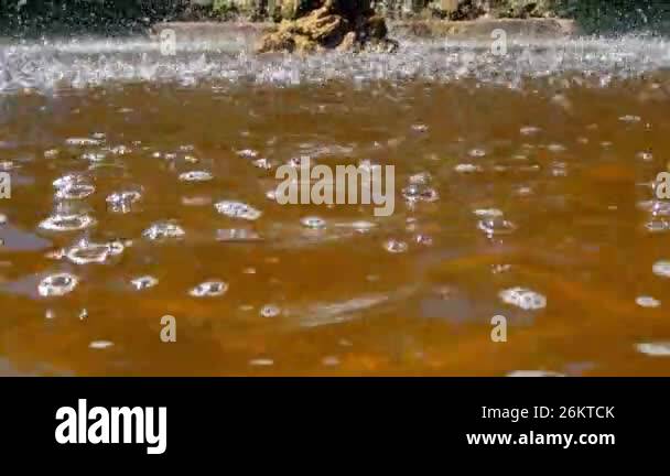 View of a natural water feature showcasing rippling waves and frothy ...