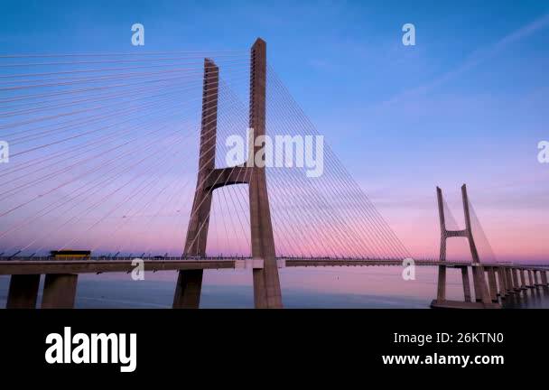 Vasco Da Gama Bridge over the Tagus River at purple sunset. Lisbon ...