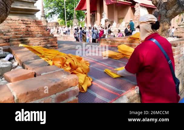 Monk organizing robes at Ayutthaya temple Stock Video Footage - Alamy