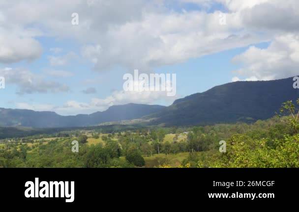 Time-lapse of clouds moving over mountainous landscape Stock Video ...
