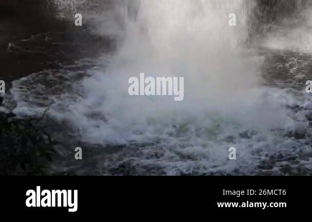 Continuous, powerful waterfall splashes in a river Stock Video Footage ...