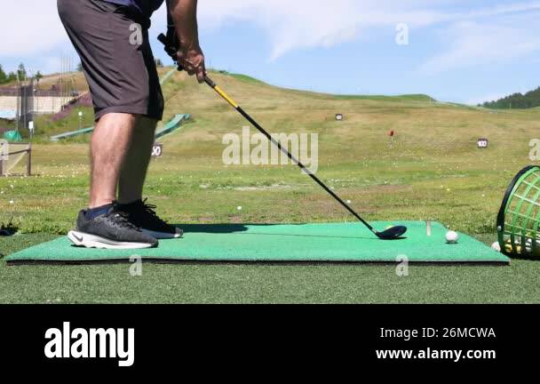 Man practicing golf swing on driving range Stock Video Footage - Alamy