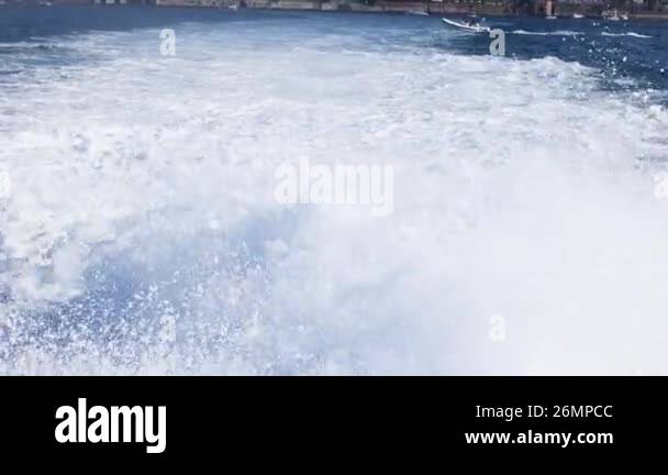 Boat moving, creating large water splash Stock Video Footage - Alamy