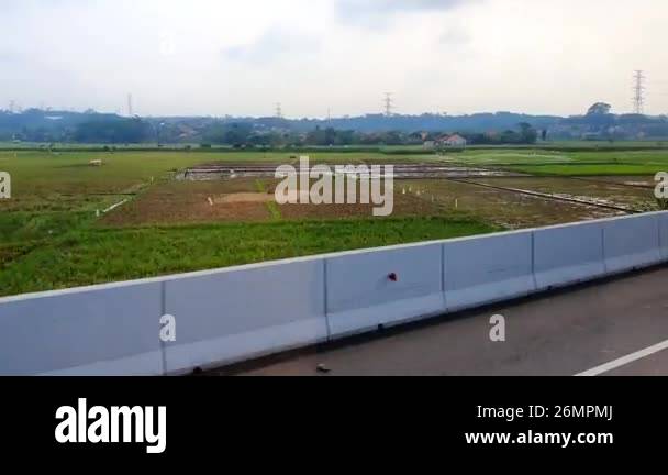 POV of sightseeing a landscape through the window from inside a moving ...