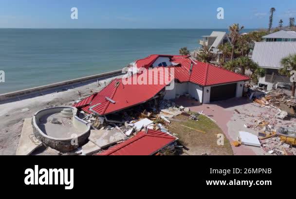 Destroyed houses on ocean coast. Hurricane Milton consequences in ...