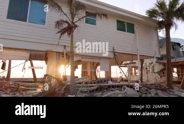 Ruined building in need of demolition or repair. Storm surge water and ...