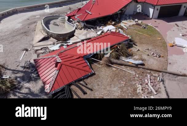 Ruined building in need of demolition or repair. Storm surge water and ...