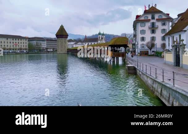 The rainy city center of Lucerne with a view on medieval wooden ...