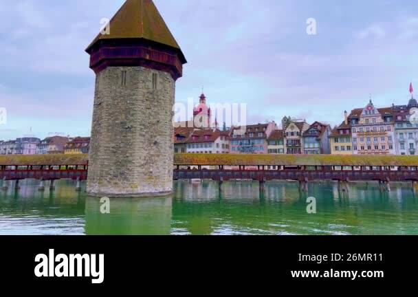 The medieval wooden Kapellbrucke bridge with stone Water Tower ...