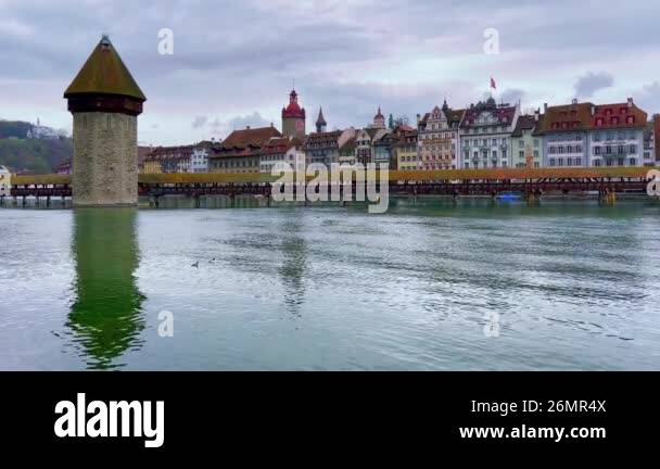 Historic covered wooden Kapellbrucke (Chapel Bridge) footbridge with ...