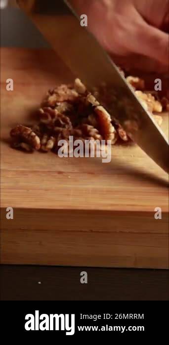 Chopping Walnuts on Wooden Board - Close-Up Stock Video Footage - Alamy