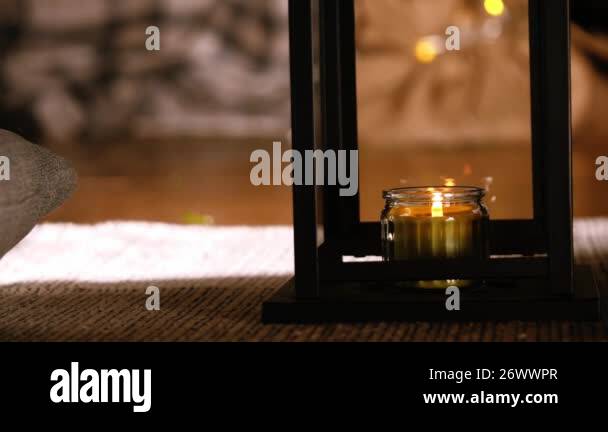 Candle in lantern with Christmas background close up zoom shot ...