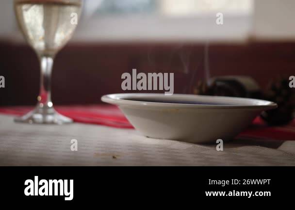 Dinner table set hot bowl of steaming food and glass of white wine 4k ...