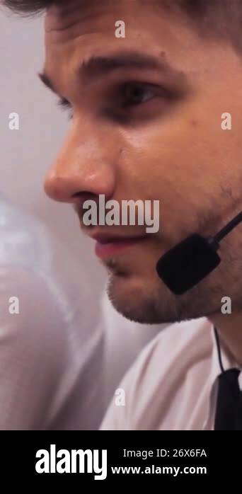 Two employee with headsets talking on voice call-centre. Entrepreneur ...