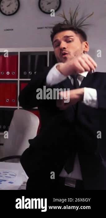 2 Crazy happy businessman and businesswoman dancing doing victory dance ...