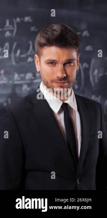 Portrait of scientist man with mathematical equations background. He ...
