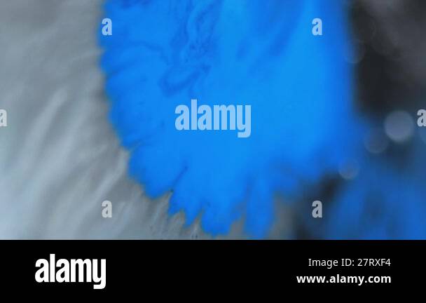 Vertical video. Paint spill. Blur acrylic blotch. Defocused blue black ...