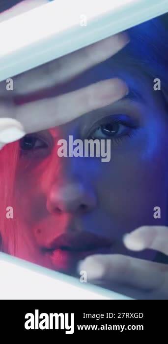 Vertical video. Neon light face. Cyberpunk beauty. Aesthetic ...