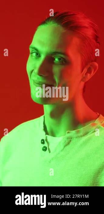 Vertical video. Mysterious man. Relax mind. Weird young tired guy in ...