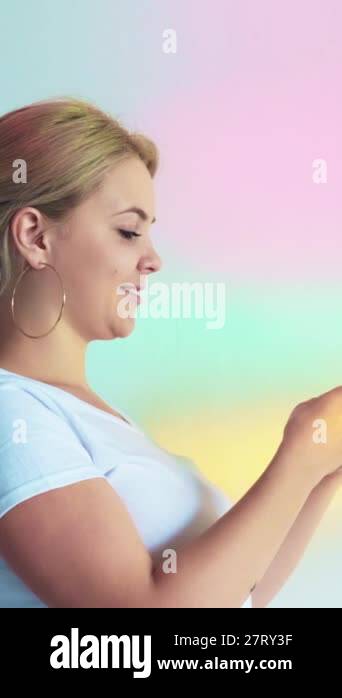 Vertical video. Typing message. Smartphone chat. Cheerful vivid woman ...