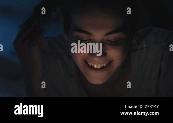 Night chat. Late communication. Online leisure. Happy playful woman ...