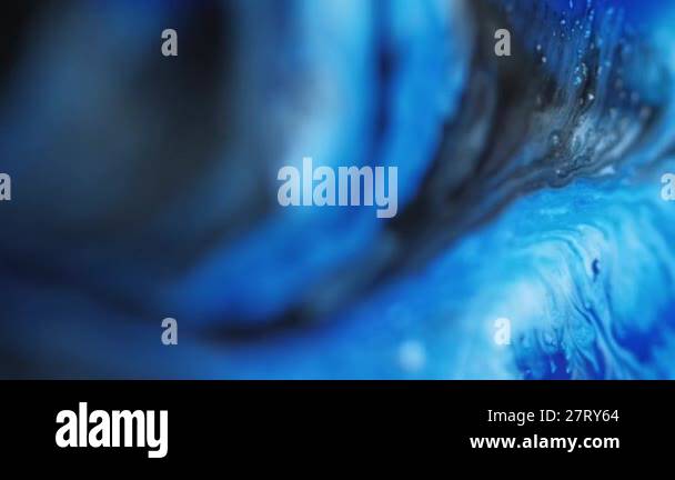 Emulsion blend. Fluid art. Blur blue black color glowing acrylic liquid ...