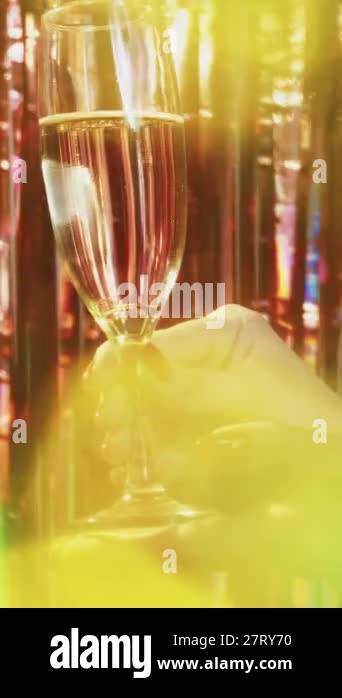 Vertical video. Champagne party. Festive celebration. Female hand ...