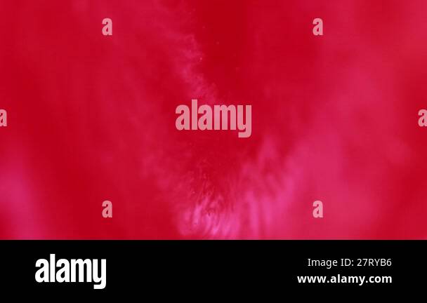 Ink water drop. Fluid spill. Defocused bright red pink color emulsion ...