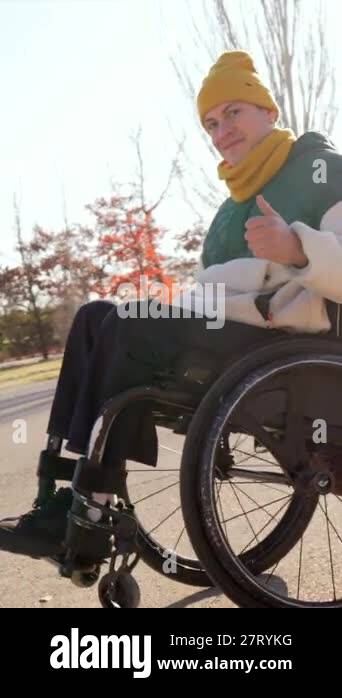 Happy disabled person enjoying sunny day outdoor, moving in his ...