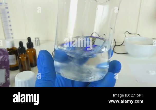 A video showcasing the process of shaking a clear, transparent serum in ...