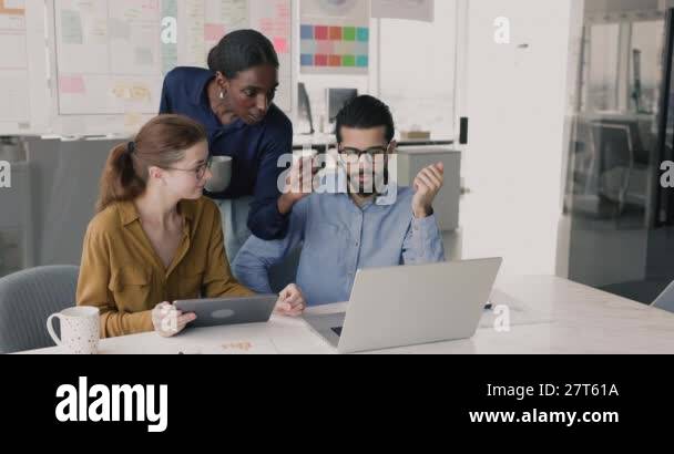 African mentor explains task details, work-related matters to team ...