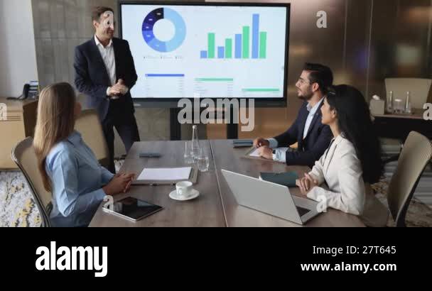 Four motivated team celebrating start-up launch, or great teamwork ...