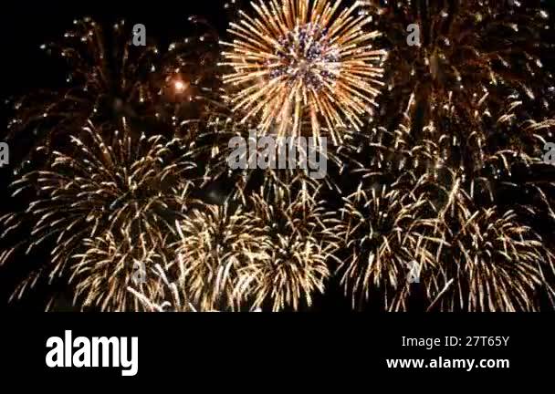 Closed-up of fireworks background with gold fireworks on midnight ...